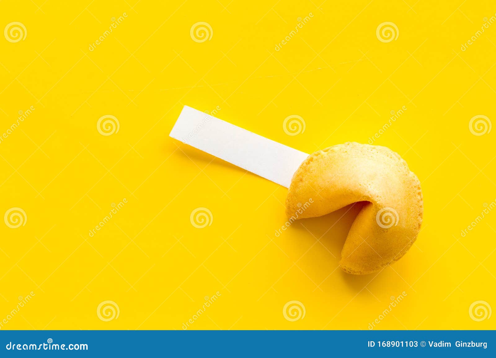 Fortune Cookie with Prediction Inside on Yellow Background Top-down ...