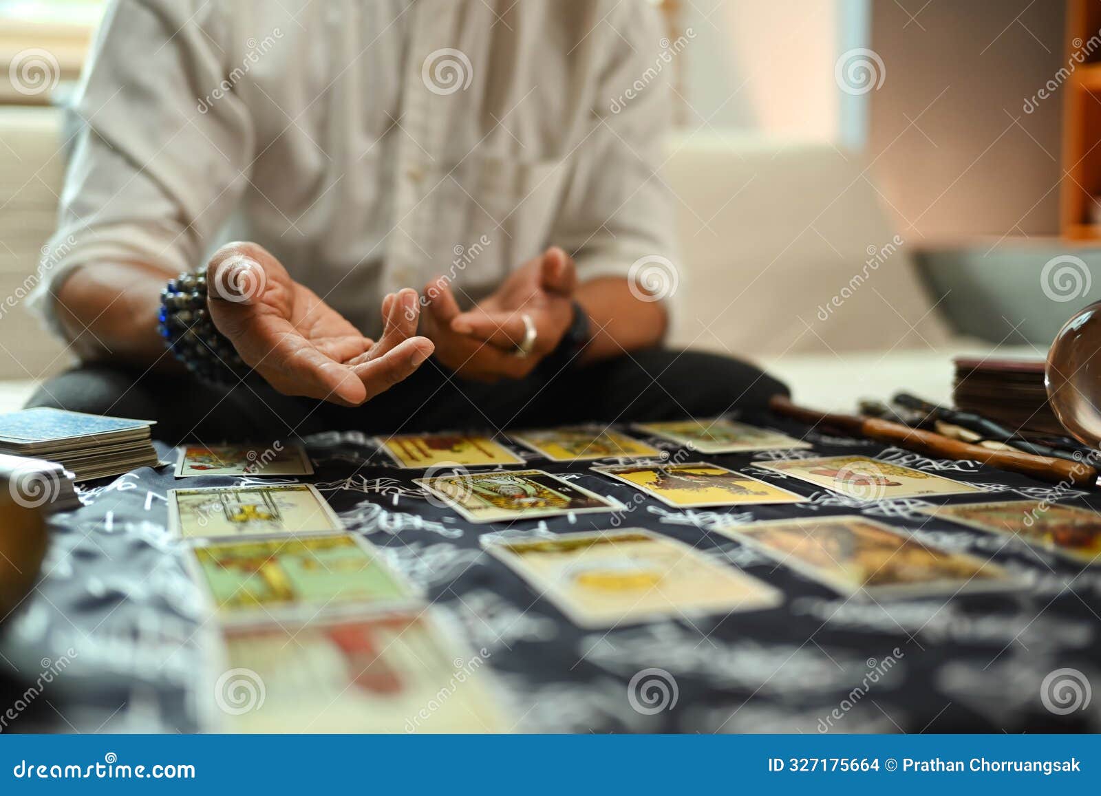 Fortune Teller Reading Tarot Cards on Table with a Mystical Cloth ...