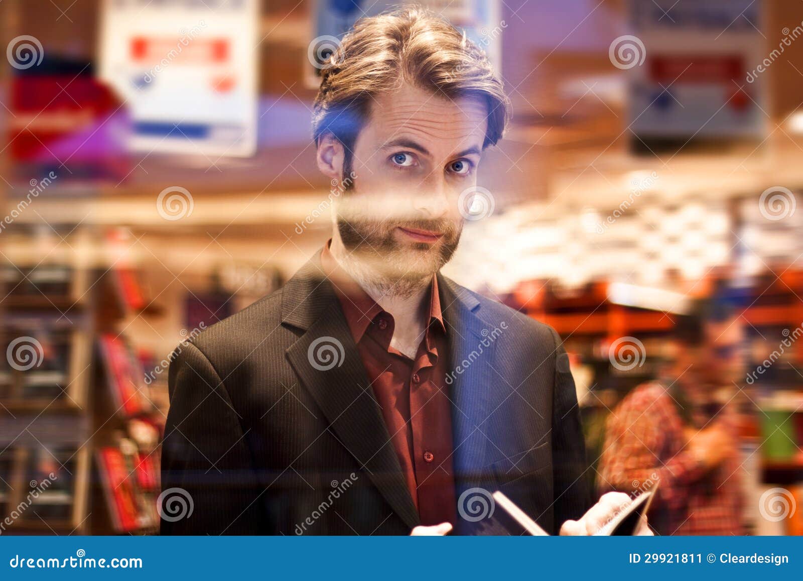 Elegant Man Standing Inside Bookstore Reading a Book Stock Image ...