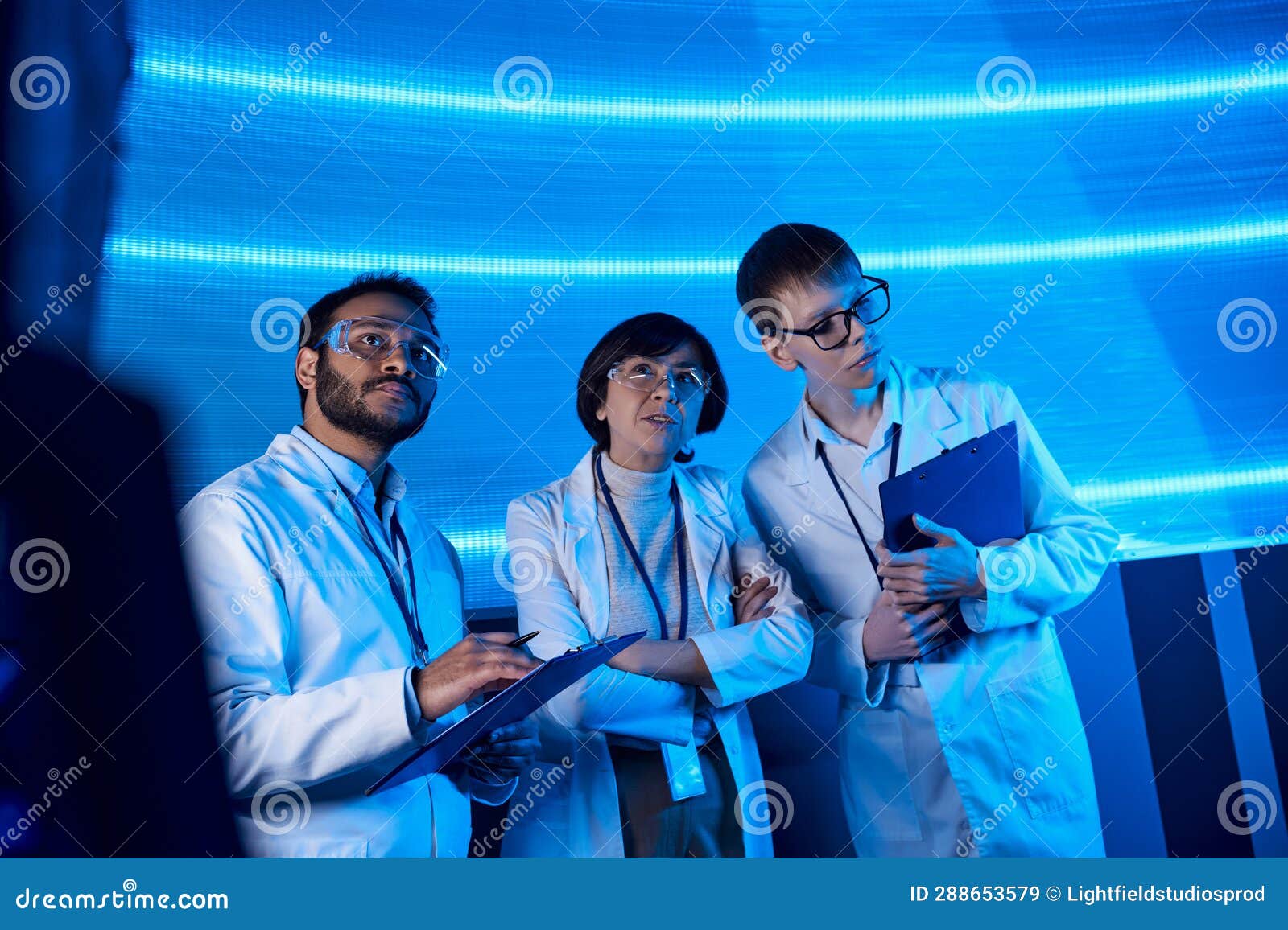 Forward-thinking Multiethnic Scientists with Clipboards Stock Image ...