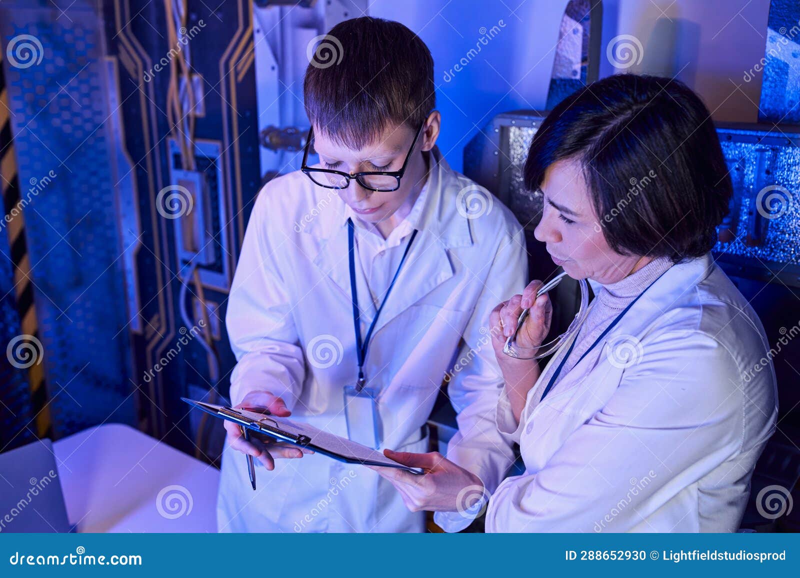 Forward-thinking Scientists Looking at Clipboard Stock Photo - Image of ...