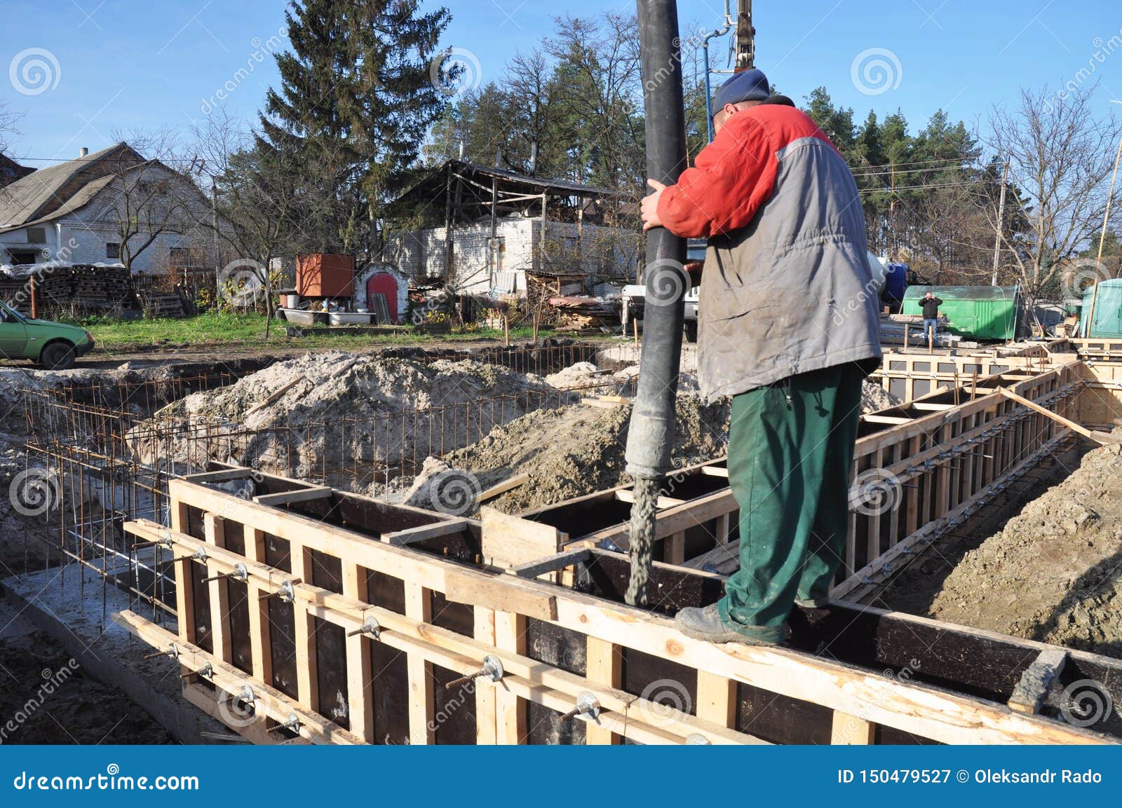 Foundation Construction. Builder Contractor is Pouring a Building ...
