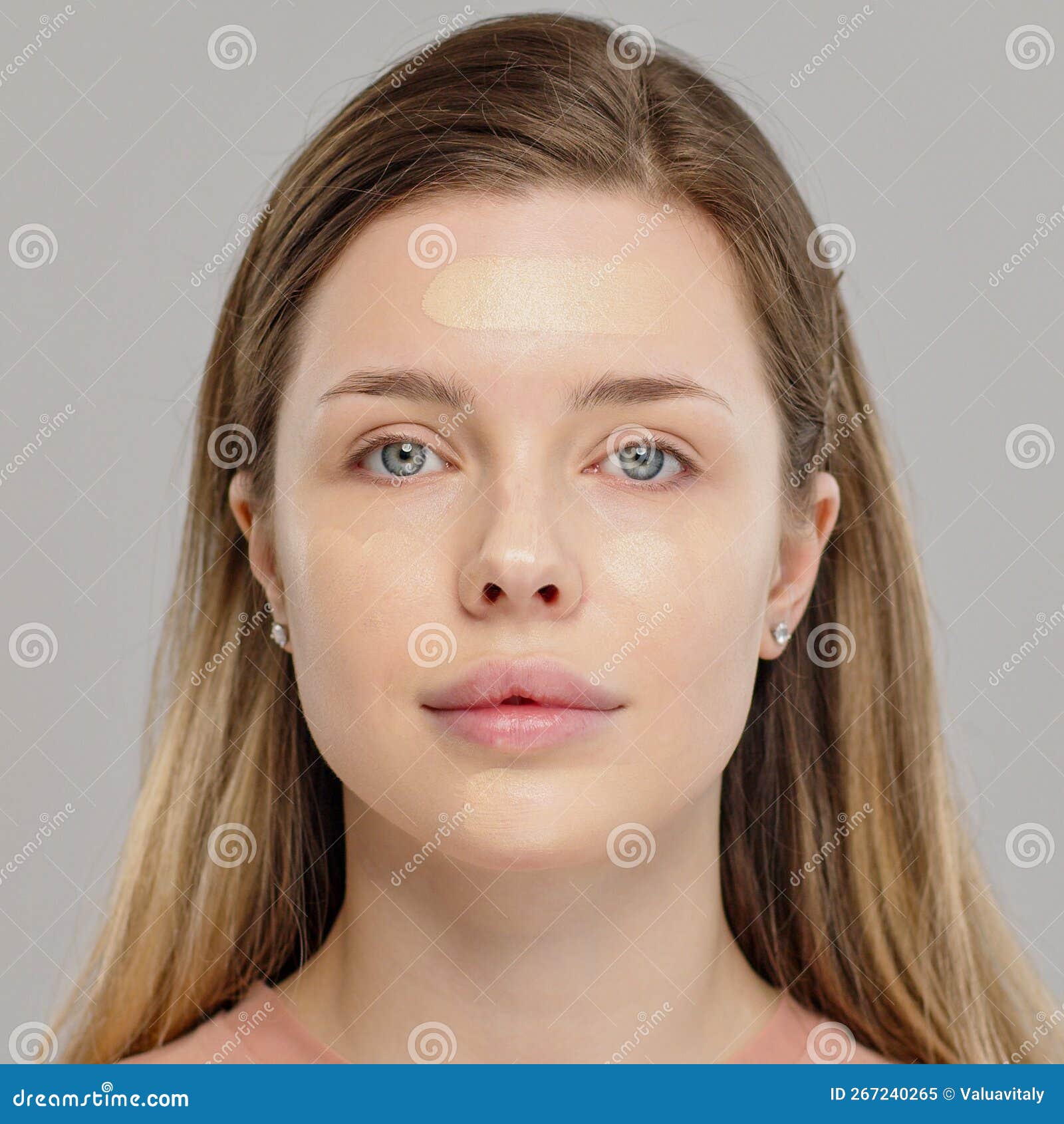 Foundation on the Face of a Female Model. Cosmetic Concealer Base on a ...