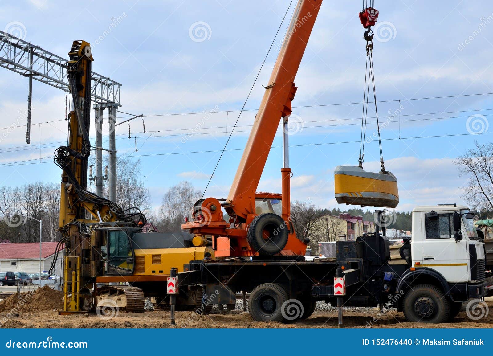 Foundation Piles Drilling Machine and Mobile Crane on the Construction ...