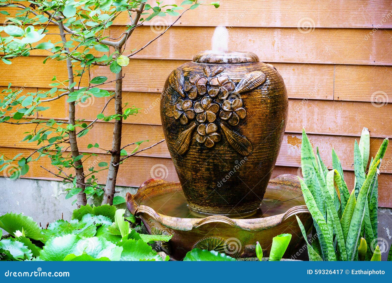 Fountain Bali-style Earthenware Jar in Garden Stock Image - Image of ...