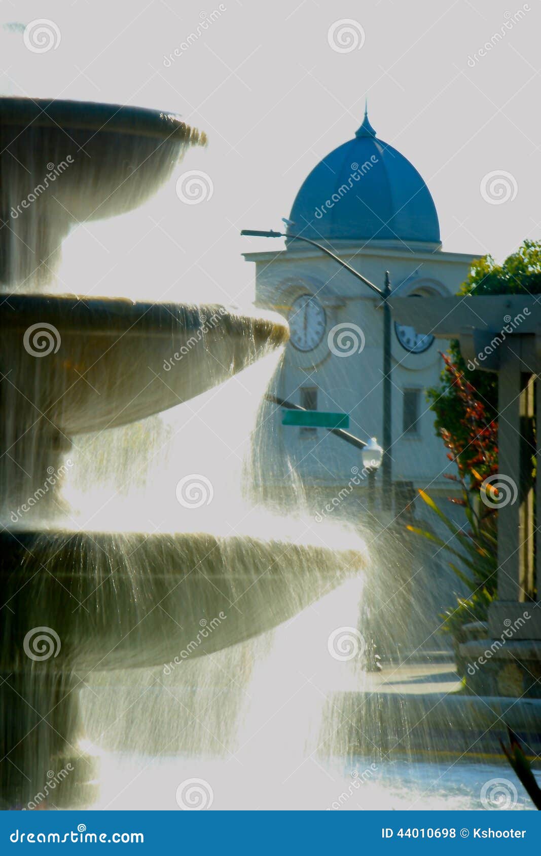 Fountain with clock tower stock photo. Image of bright - 44010698