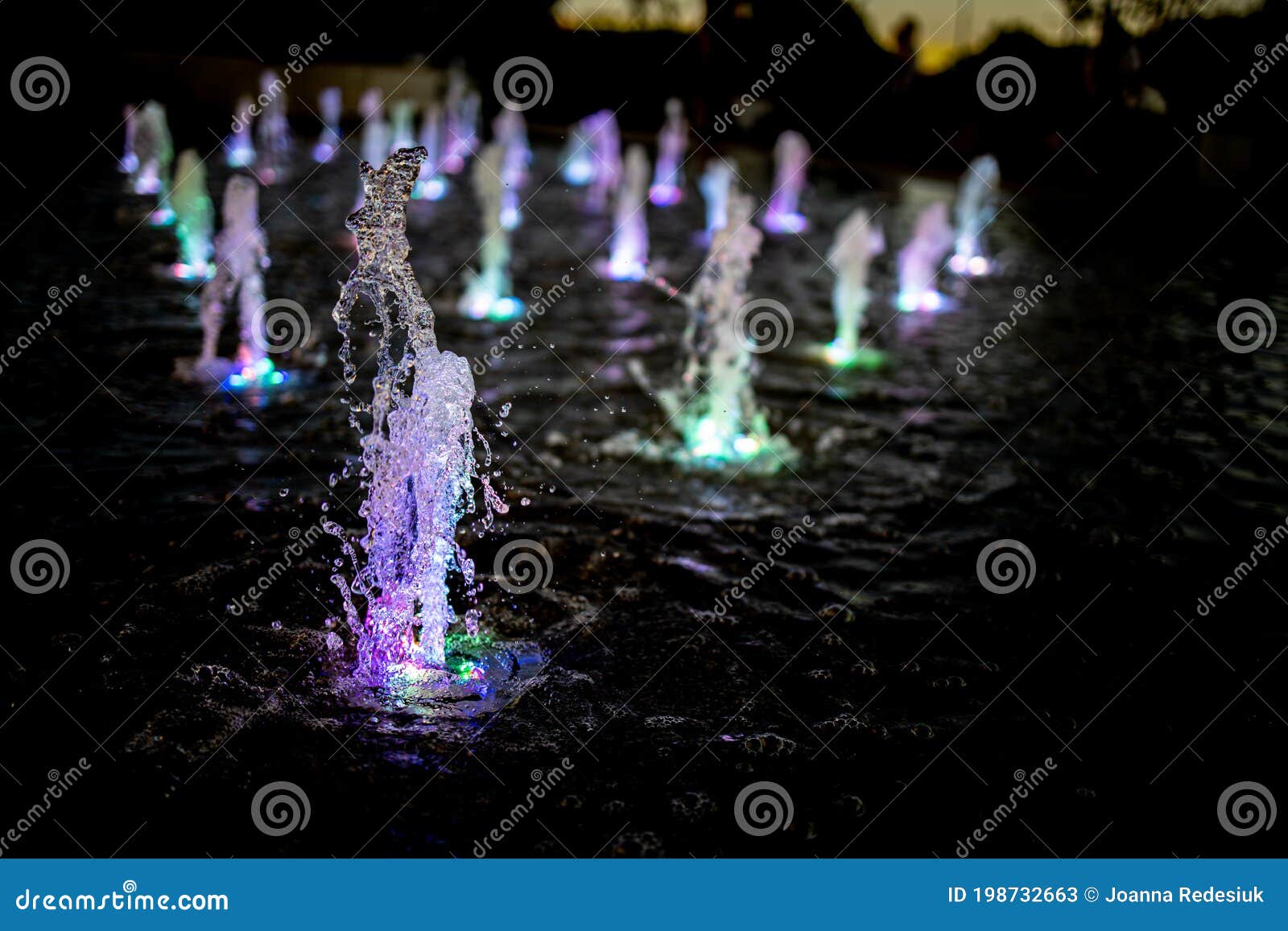 Fountain with Colorfully Lit in the Evening Stock Image - Image of ...
