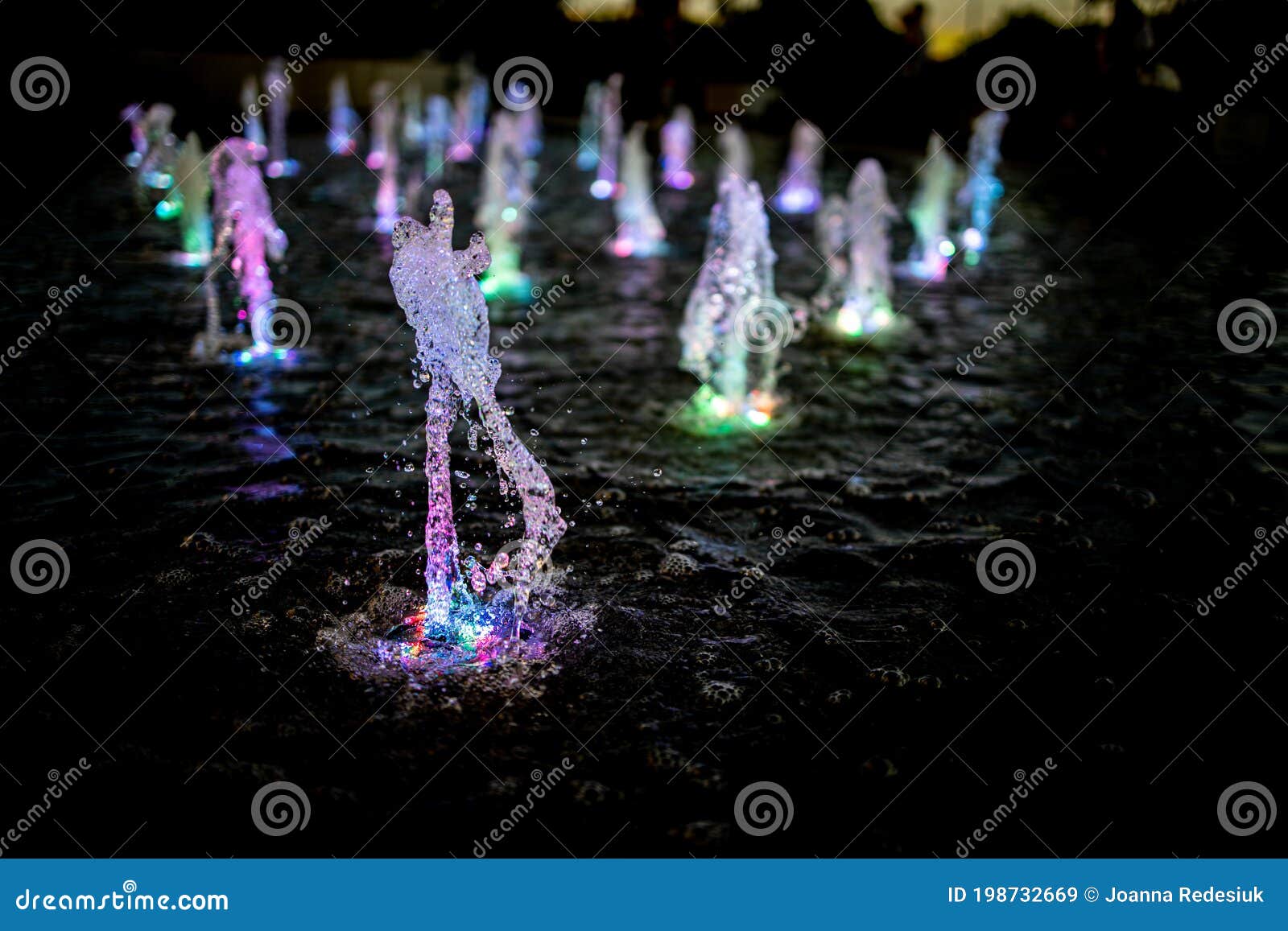 Fountain with Colorfully Lit in the Evening Stock Image - Image of ...