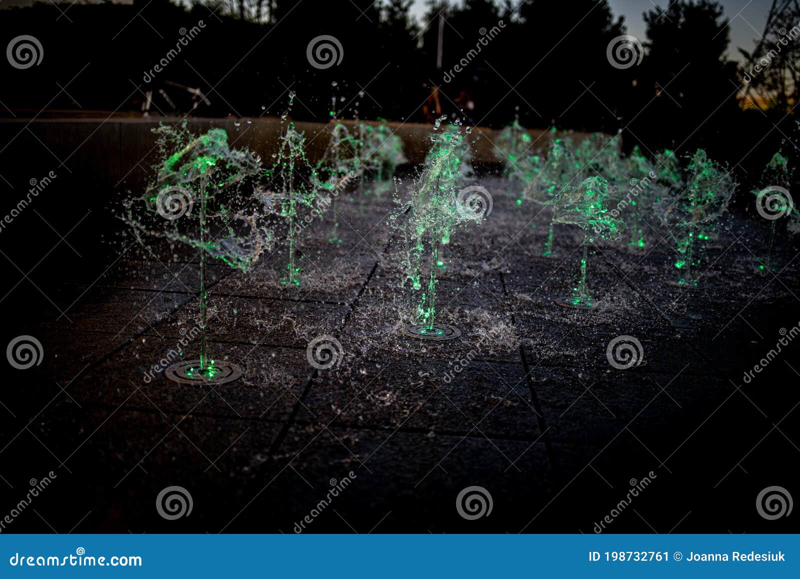 Fountain with Colorfully Lit in the Evening Stock Image - Image of ...