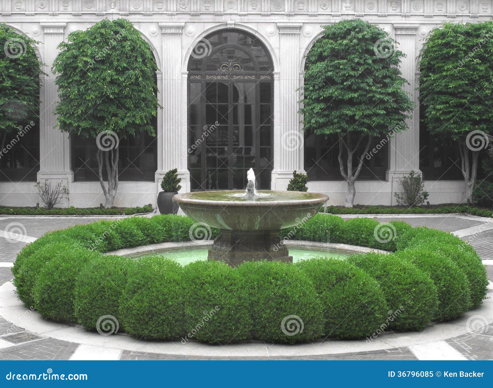 Fountain in a courtyard stock image. Image of shrubs - 36796085