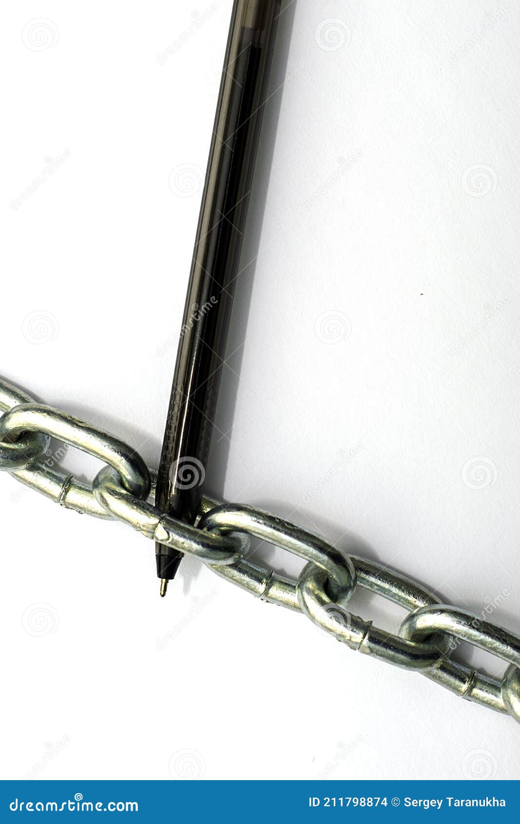 A Fountain Pen Stuck in a Chain on Sheets of White Paper the Concept of ...