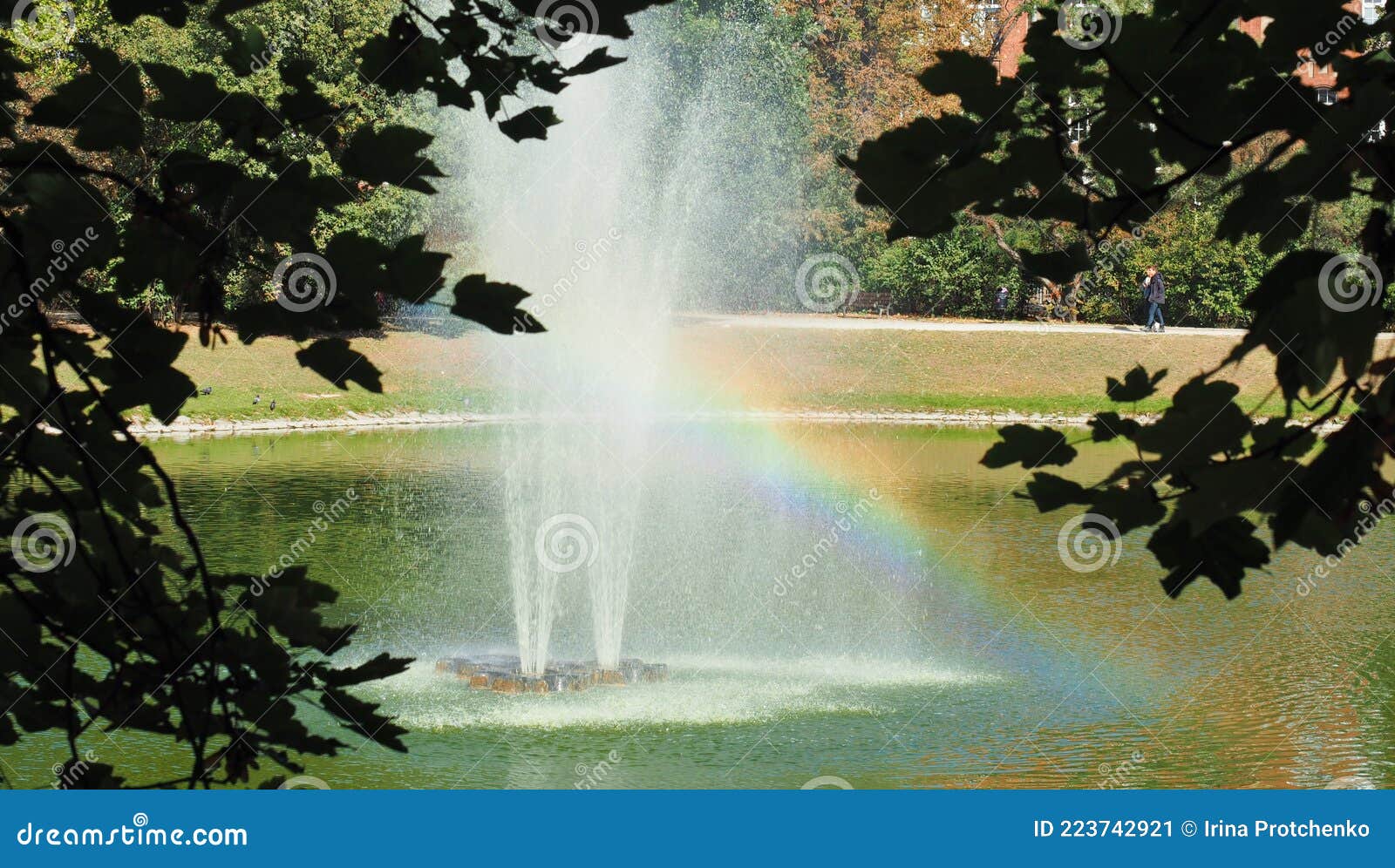Fountain with a rainbow. stock image. Image of leaf - 223742921