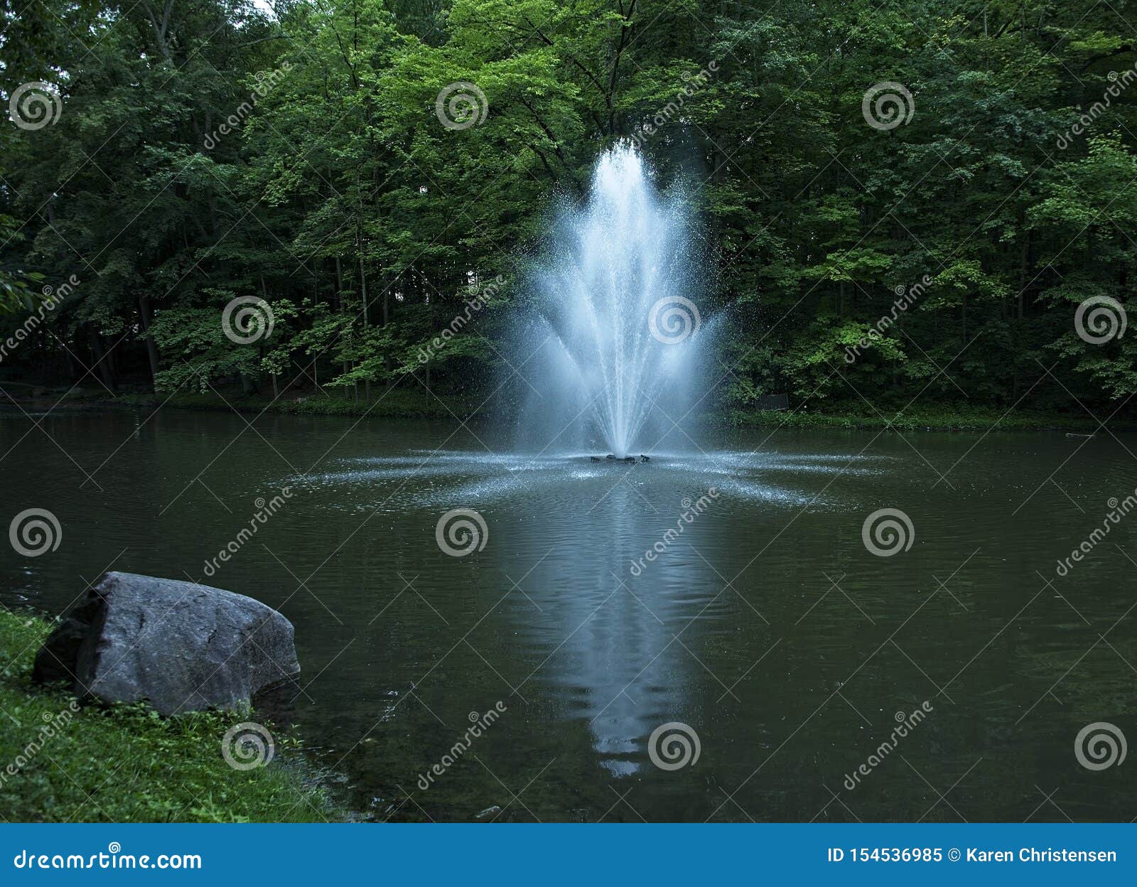 Fountain and Reflection in Pond Stock Image - Image of leaf, natural ...