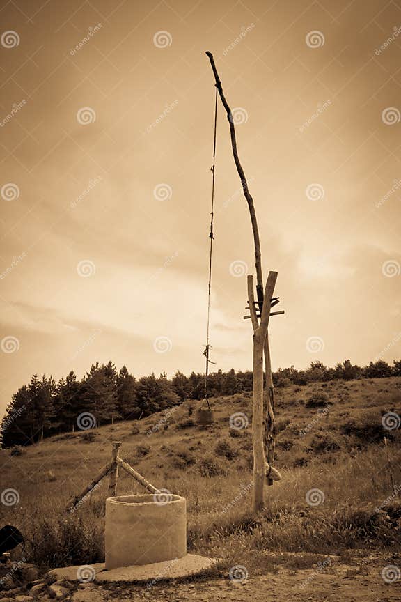 Fountain with shadoof stock photo. Image of concrete - 22722046