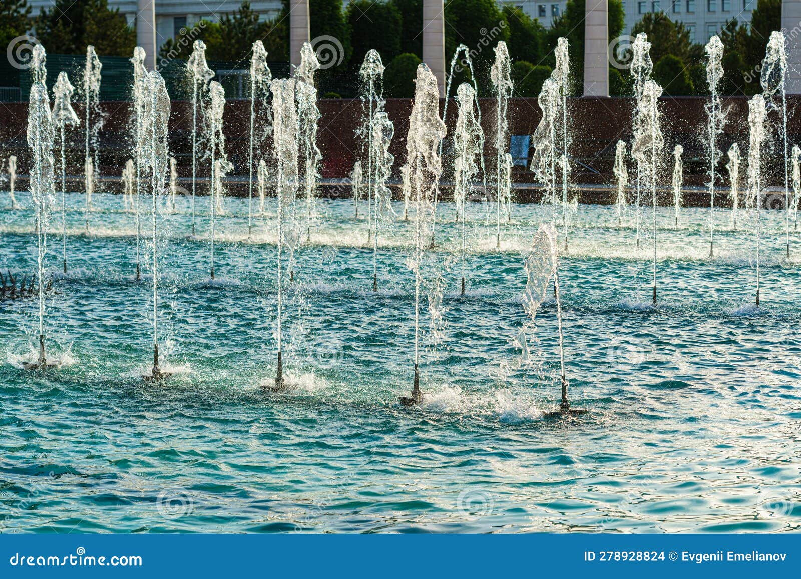 Fountains Illuminated by Sunlight at Sunset or Sunrise in the Park at ...