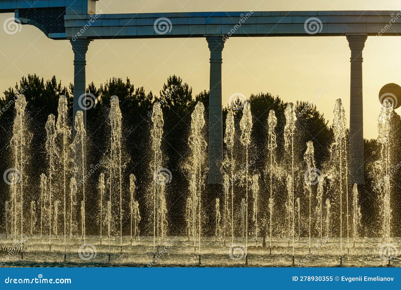 Fountains Illuminated by Sunlight at Sunset or Sunrise in the Park at ...