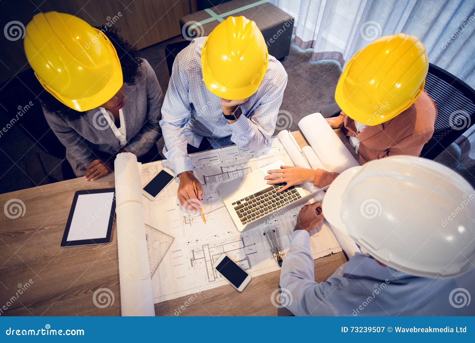 Four Architects Discussing Blueprints in Meeting Stock Image - Image of ...