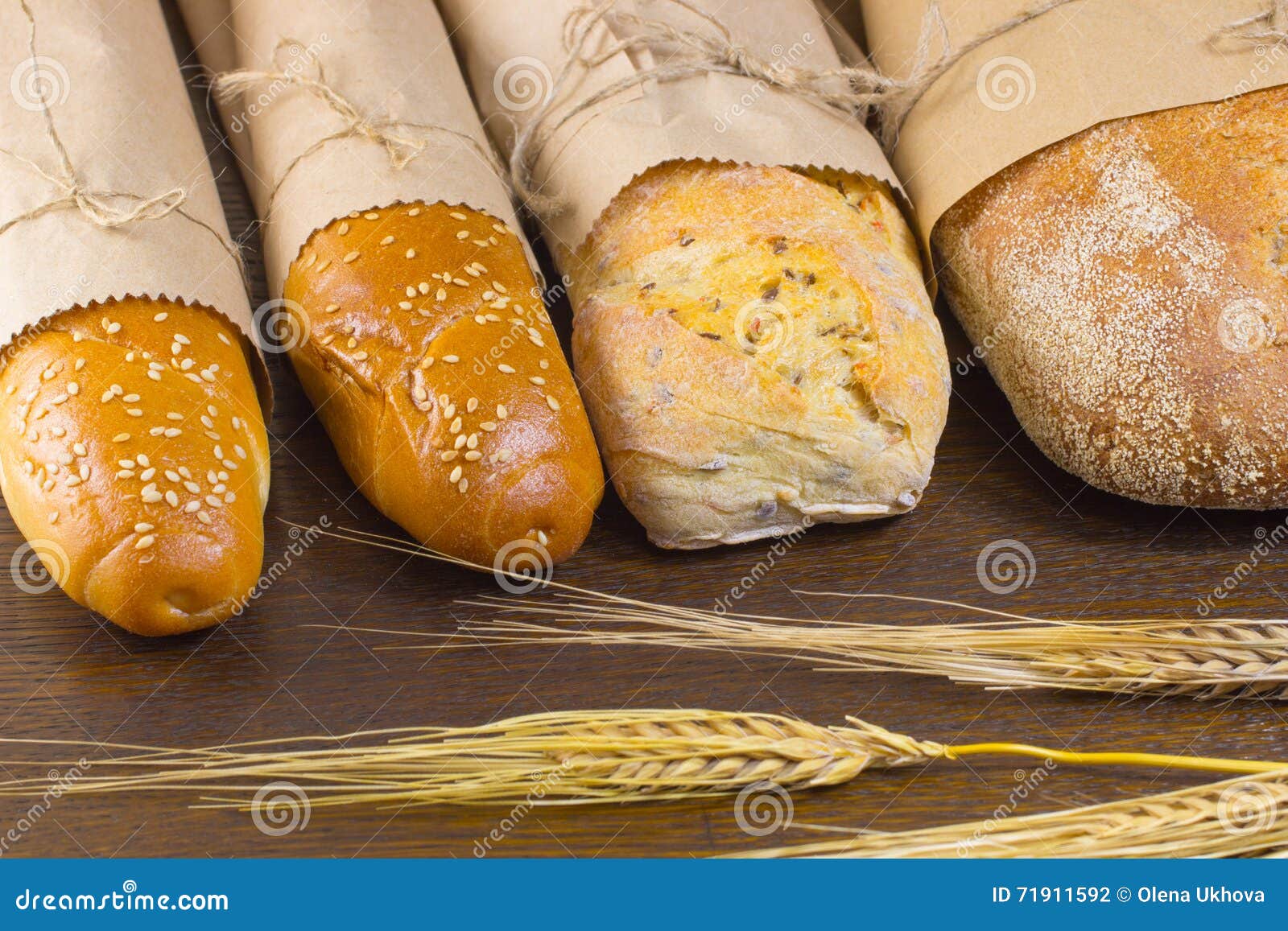 Four Baguette and Sticks of Barley on Table Stock Photo - Image of ...