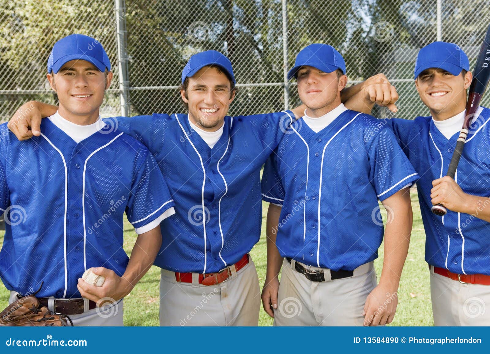 Four Baseball Team-mates Posing on Field Stock Photo - Image of four ...