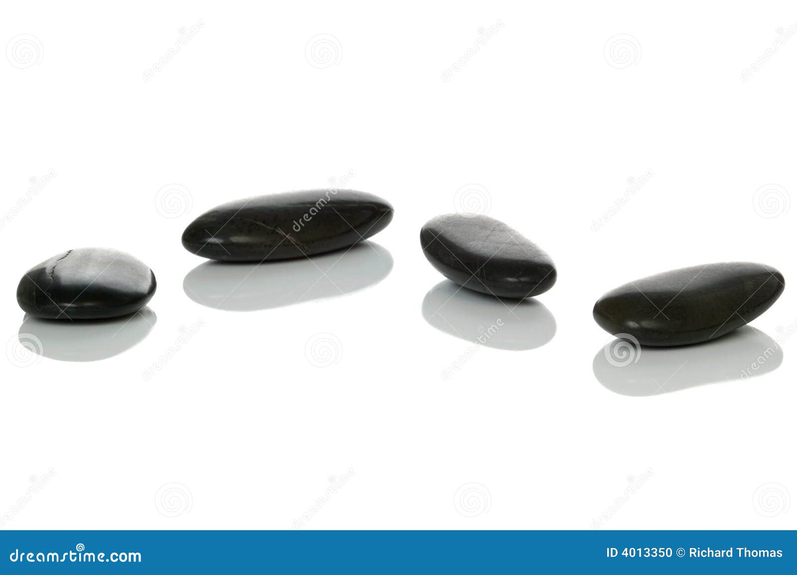 Four black pebbles stock photo. Image of pebble, shiny - 4013350