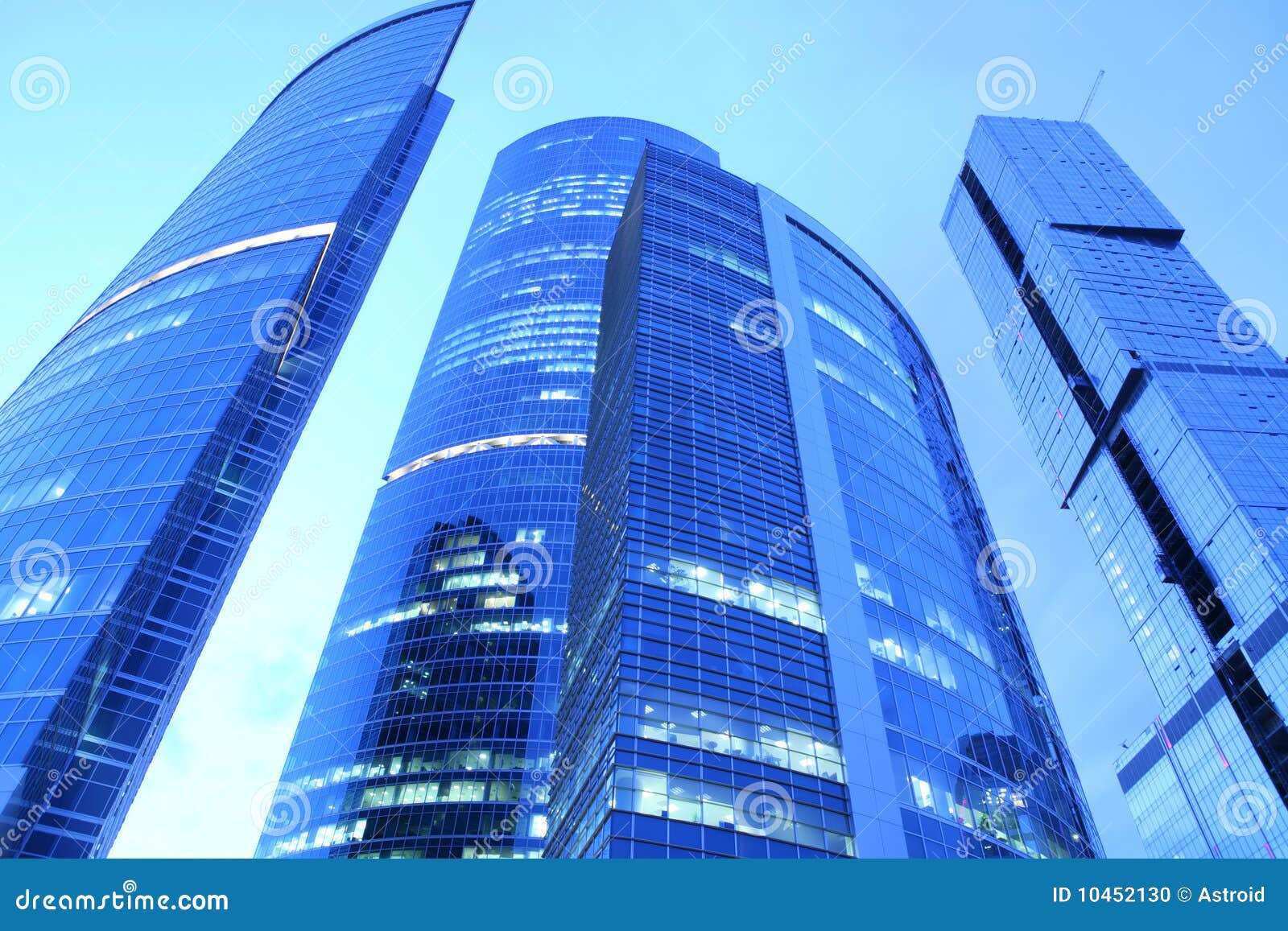 Four blue skyscrapers stock photo. Image of glass, dark - 10452130