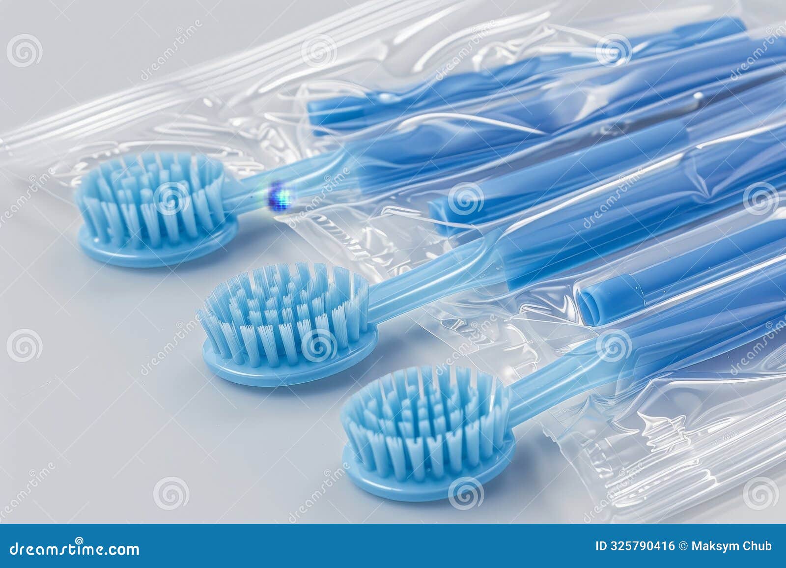 Four Blue Toothbrushes Sealed in Clear Plastic Packaging on a White ...