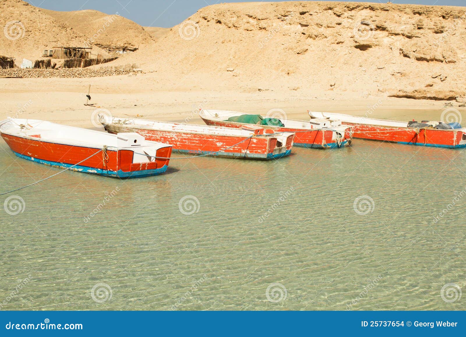 Four boats on the beach stock photo. Image of scene, boats - 25737654