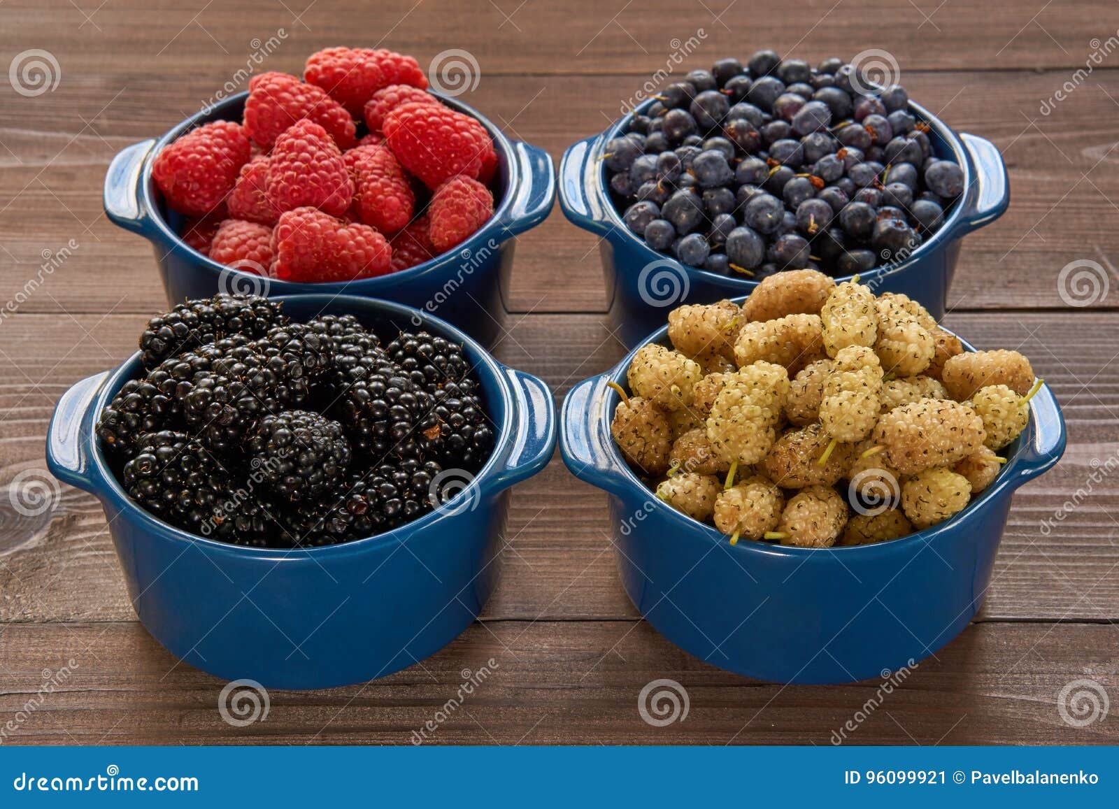 Four bowls with berries stock image. Image of mulberry - 96099921