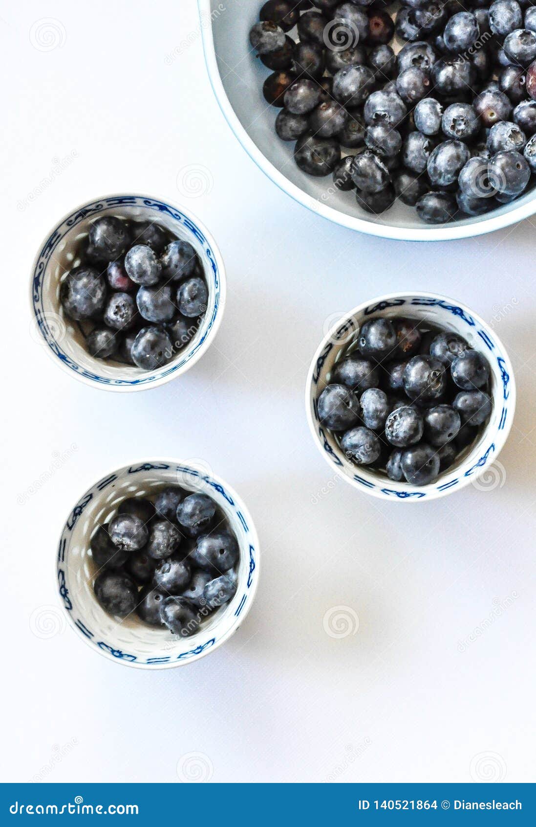 Four Bowls of Fresh Blueberries on a White Background Stock Photo ...