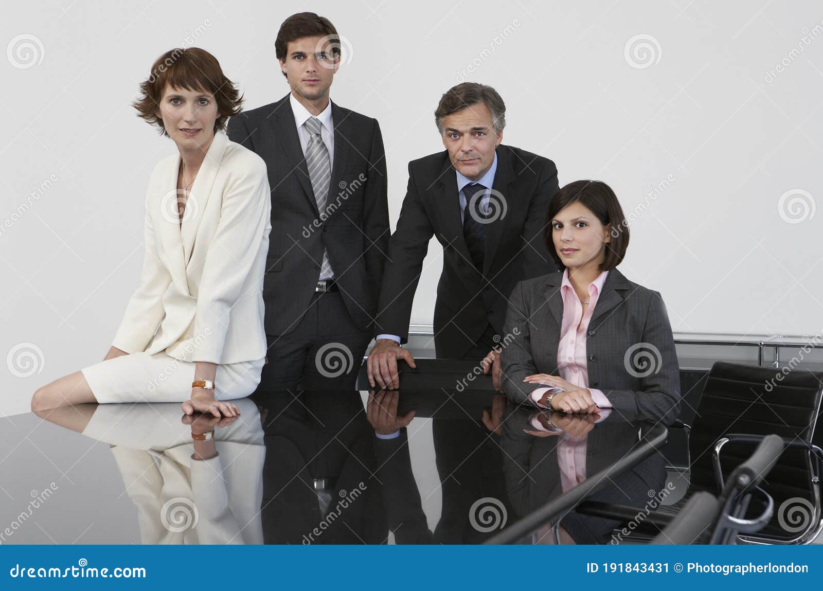 Four Business Colleagues at Conference Table Portrait Stock Image ...