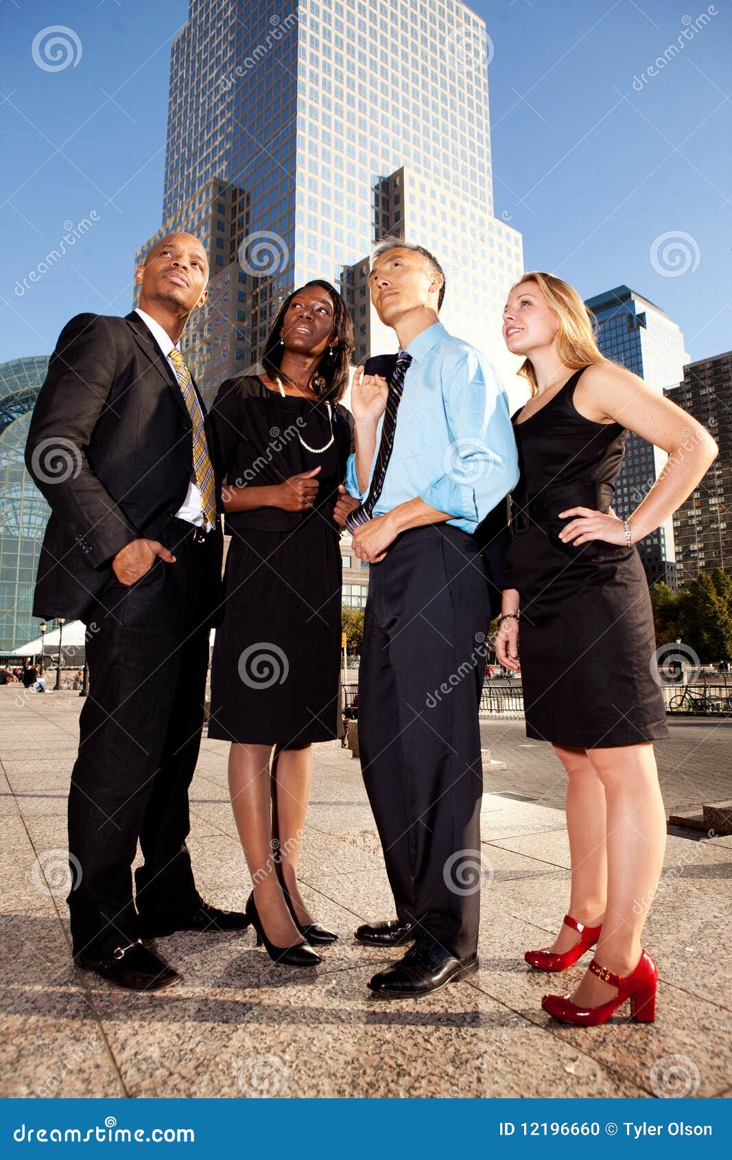 Four Business People Looking Upwards Stock Photo - Image of handsome ...