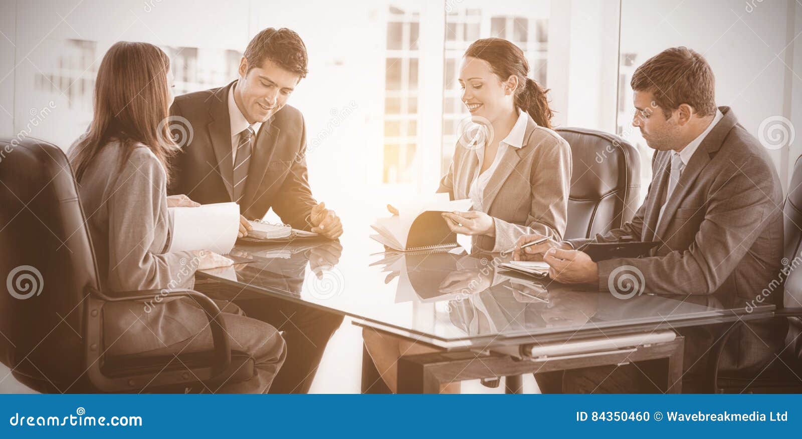 Four Business People during a Meeting Stock Photo - Image of close ...