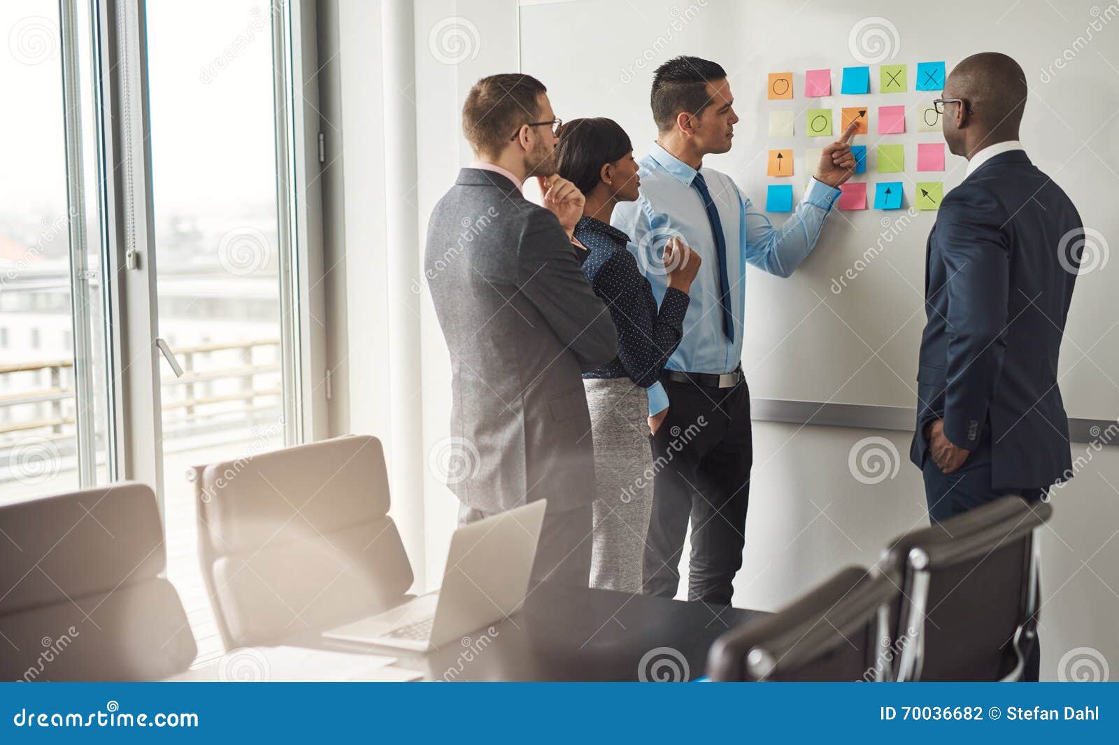 Four Business People Planning with Sticky Notes Stock Photo - Image of ...
