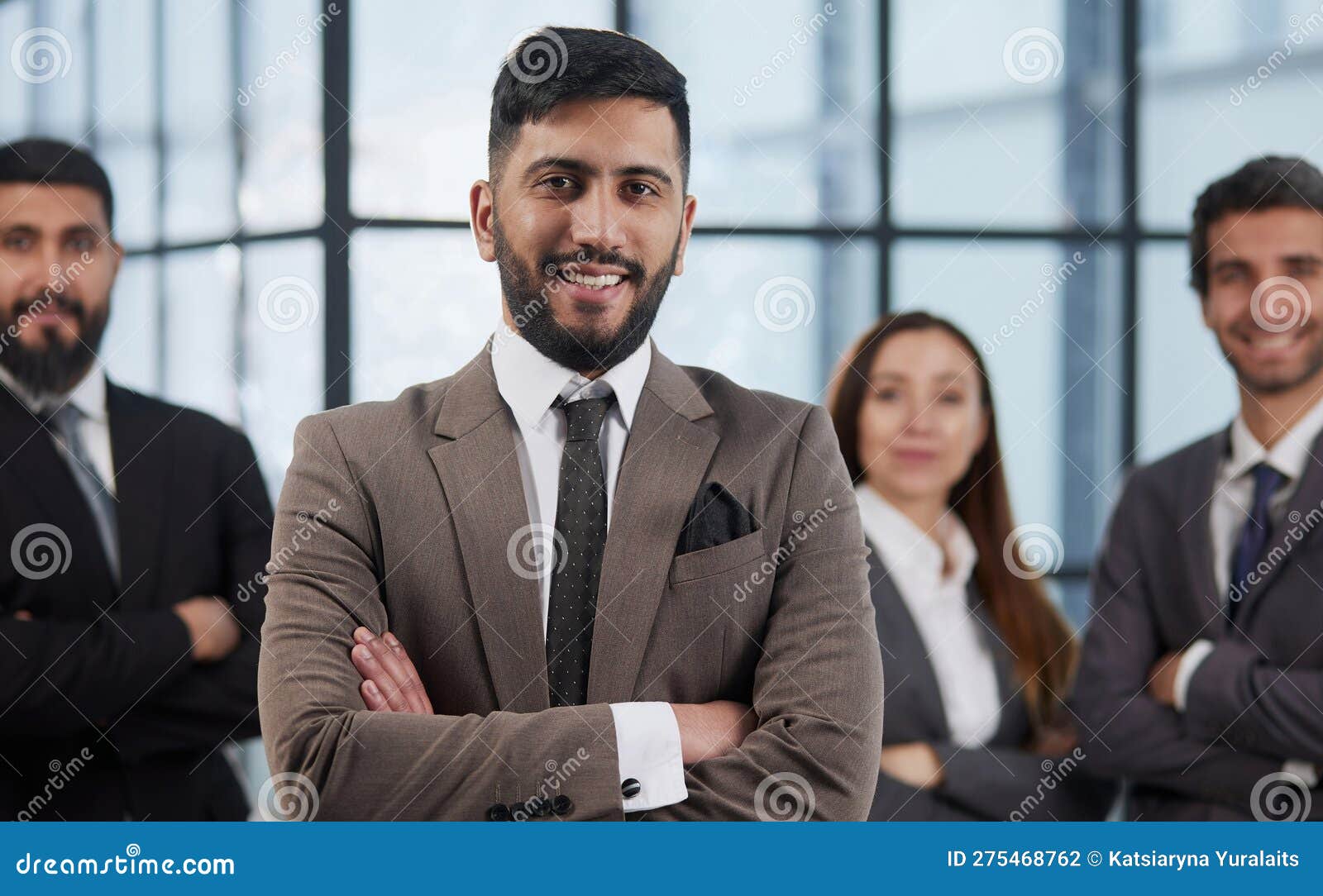 Four Business People Posing in a Modern Setting Stock Photo - Image of ...