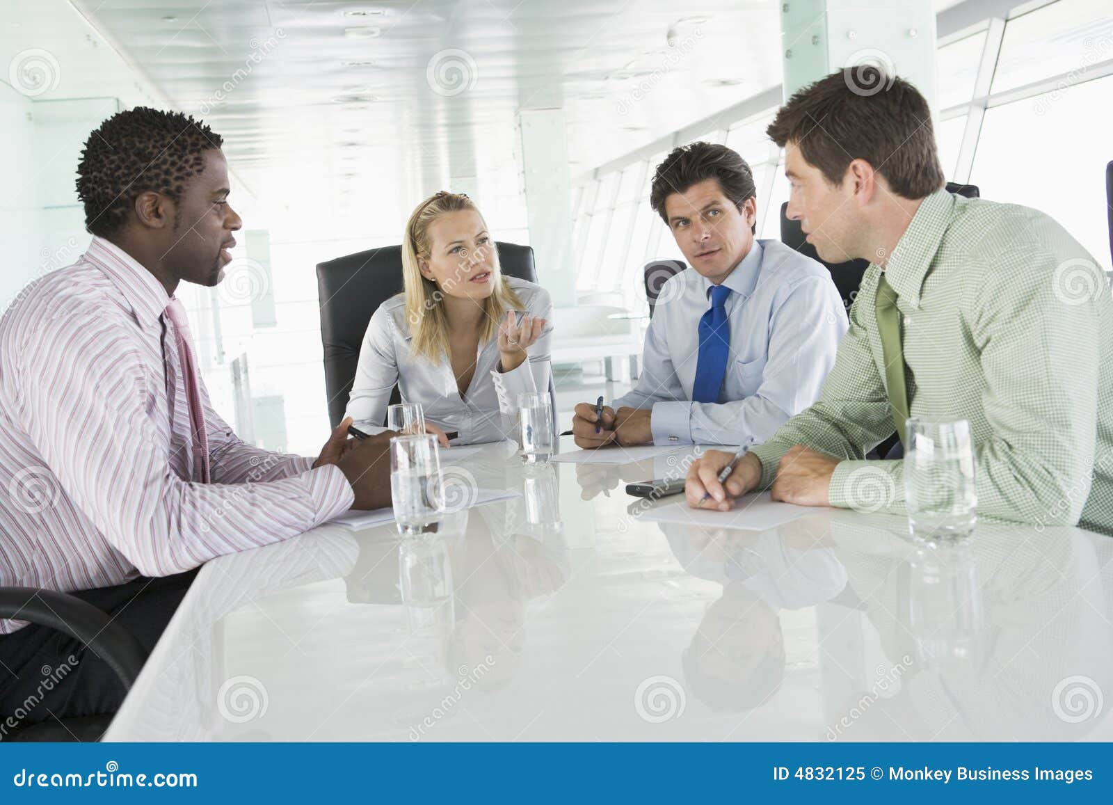 Four Businesspeople Having Meeting Stock Image - Image of american ...