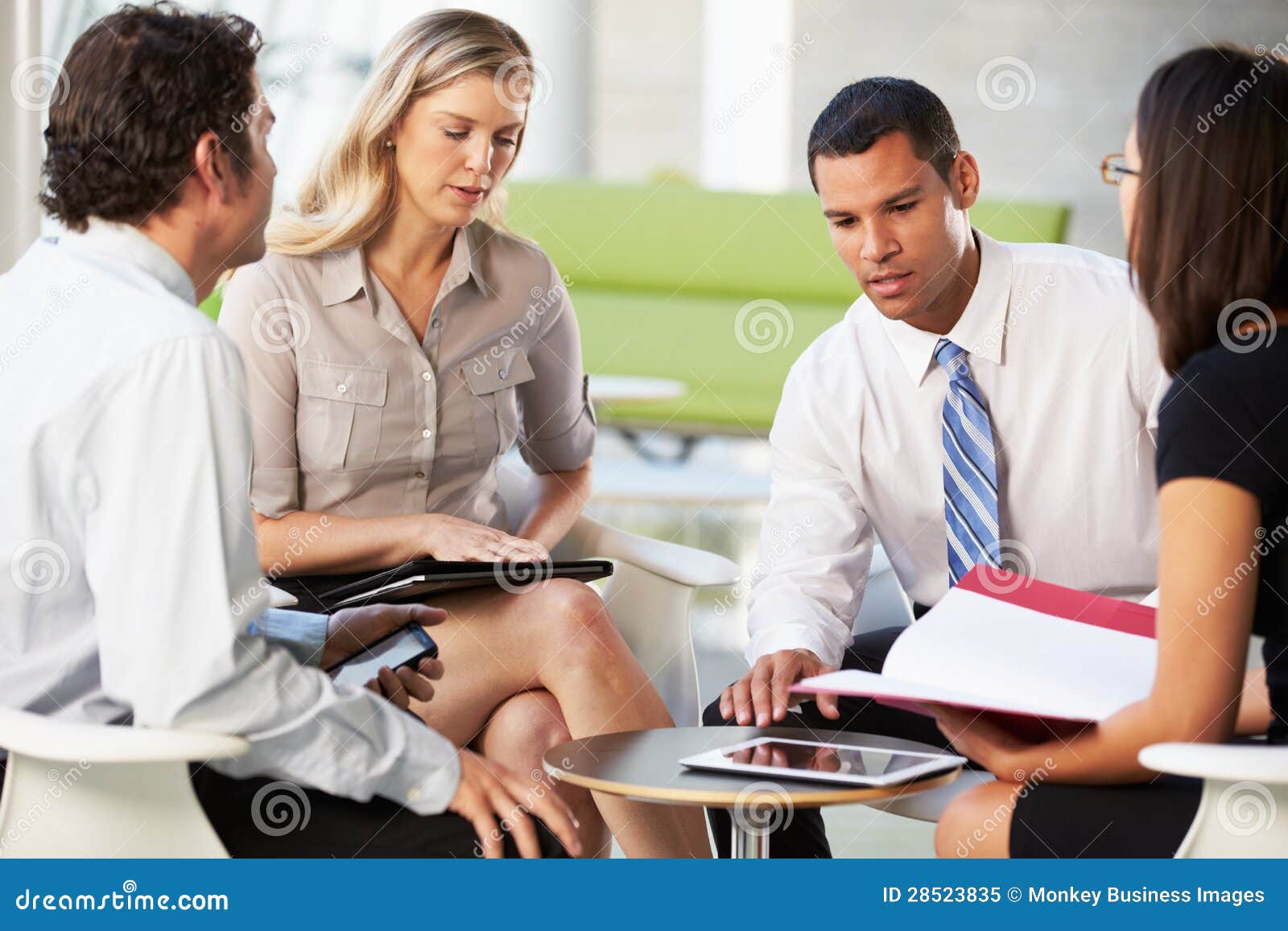 Four Businesspeople Having Meeting in Modern Office Stock Image - Image ...