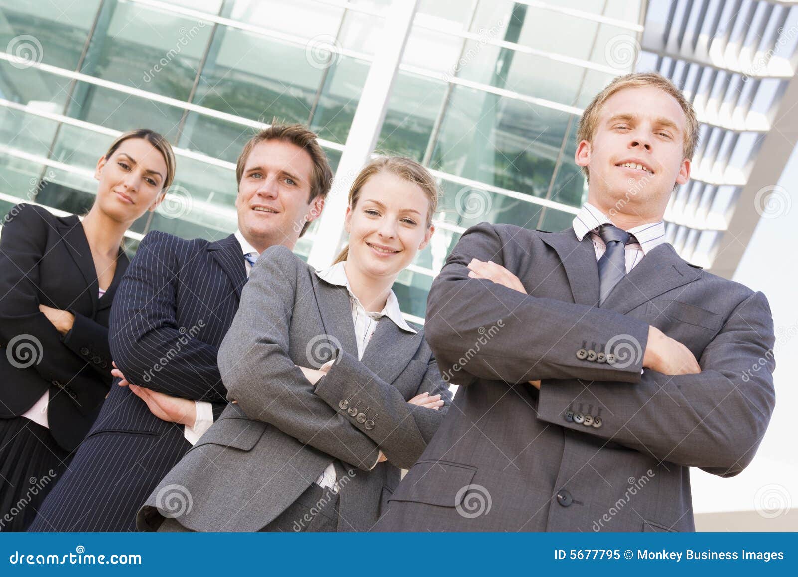 Four Businesspeople Standing Outdoors Smiling Stock Image - Image of ...