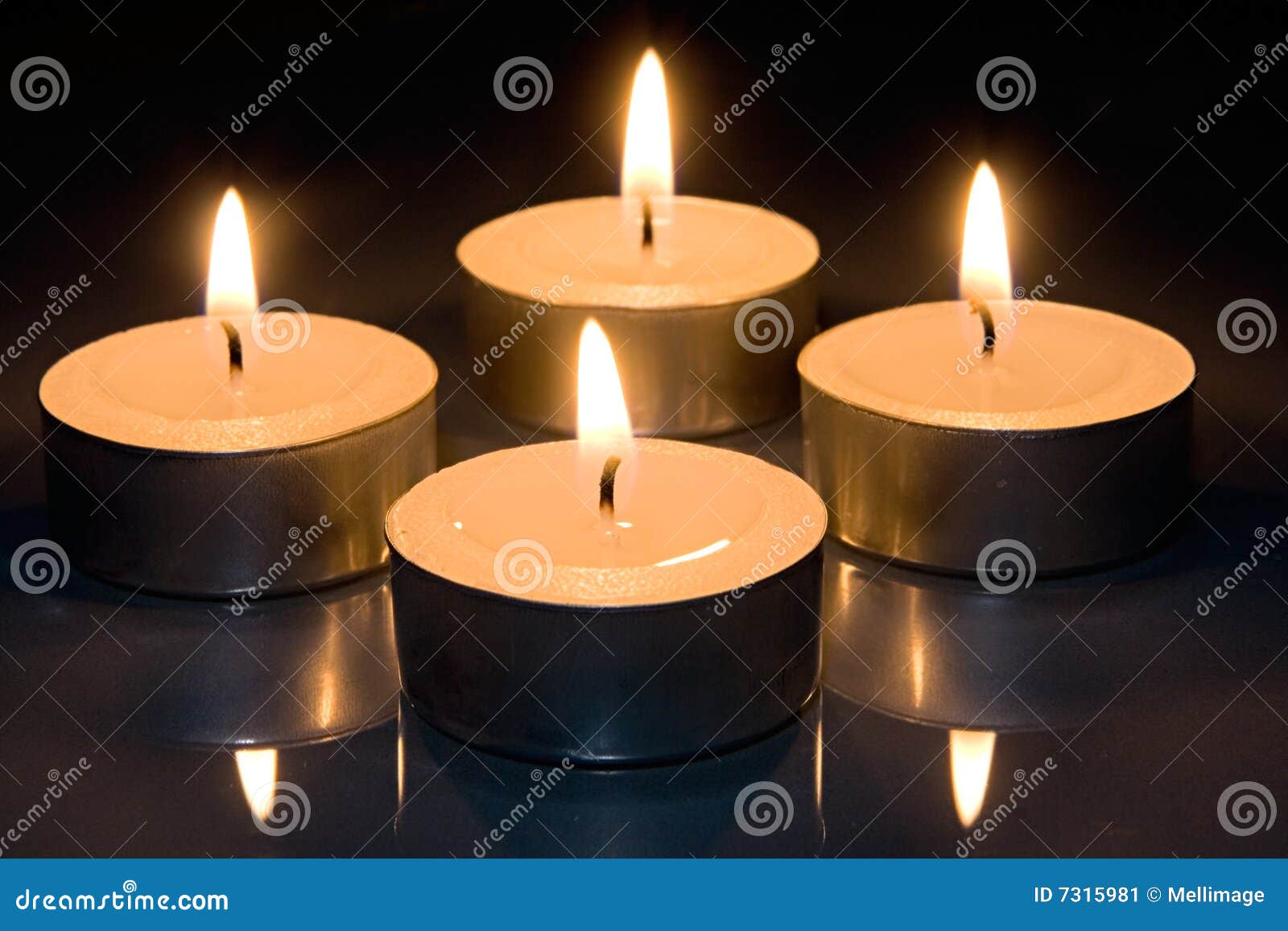 Four candles stock image. Image of dark, flicker, flame - 7315981
