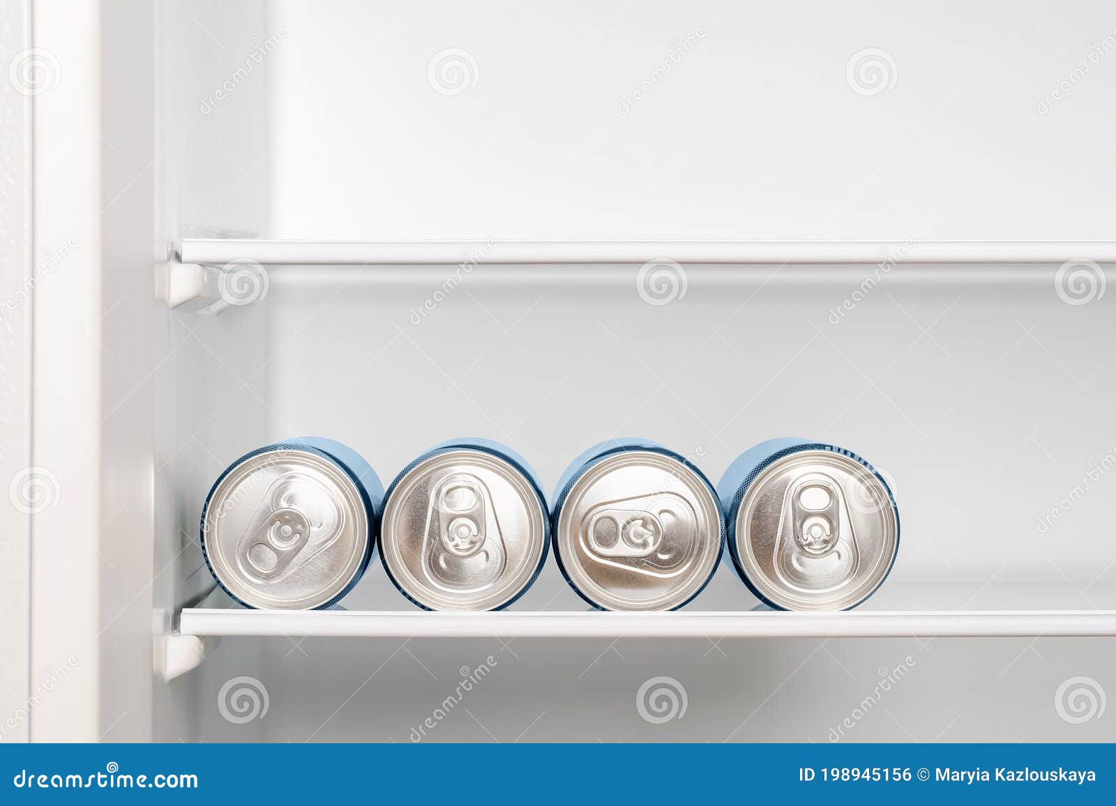 Four Cans of Beer or Soda on the Shelf in an Empty Home Fridge. Cooling ...
