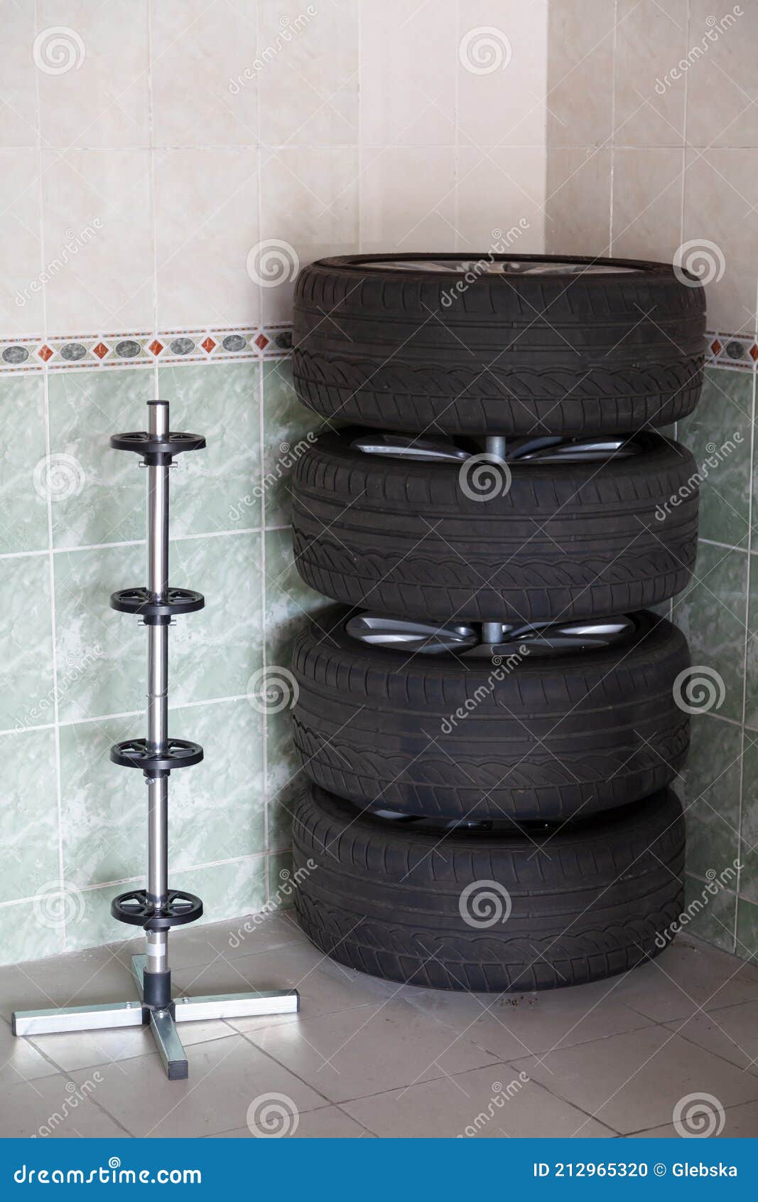 Four Car Wheels Stand Vertically in Corner of Garage Stock Photo ...