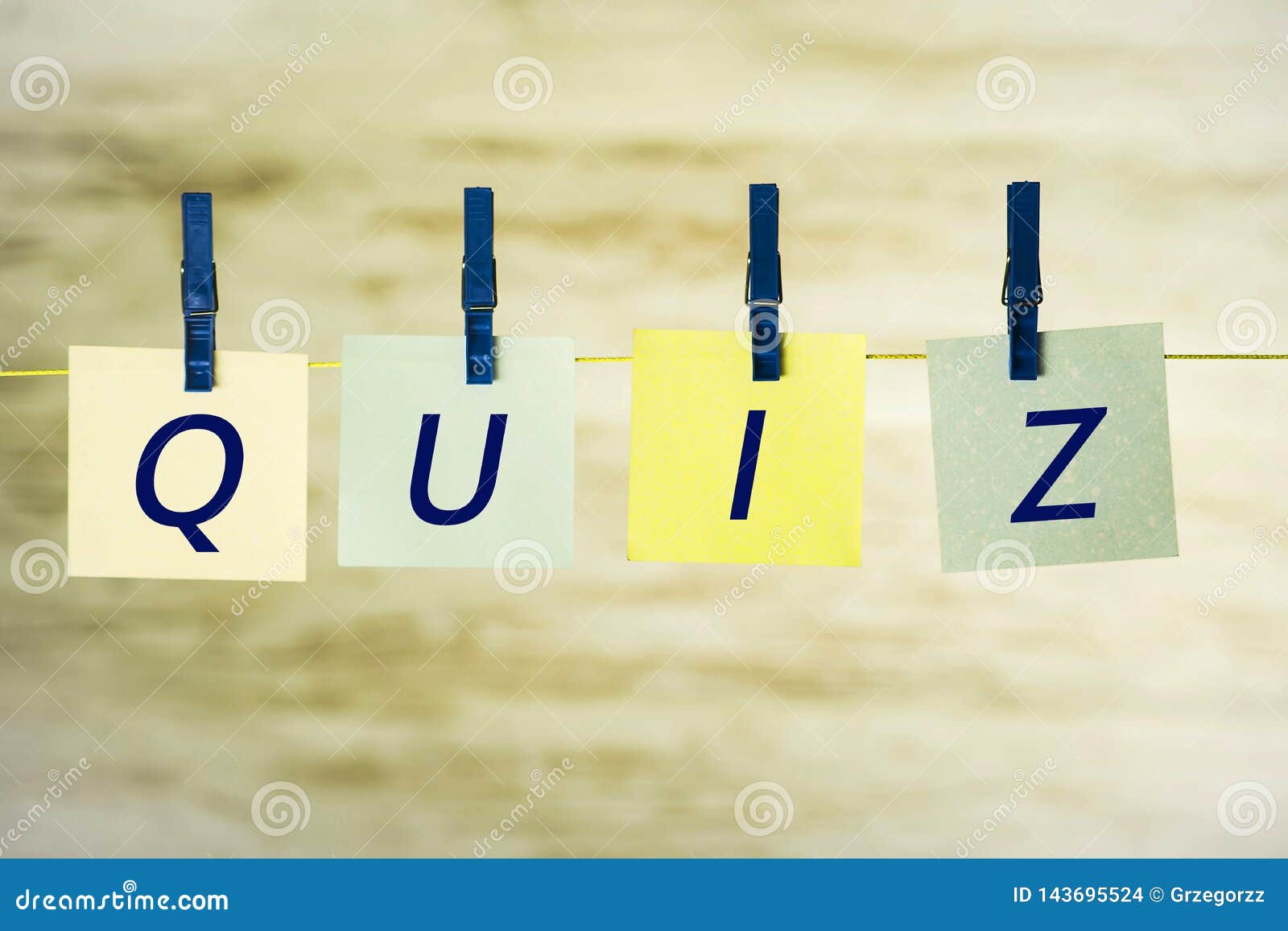 Four Cards Hanging on a String, with the Word Quiz, Attached with Blue ...