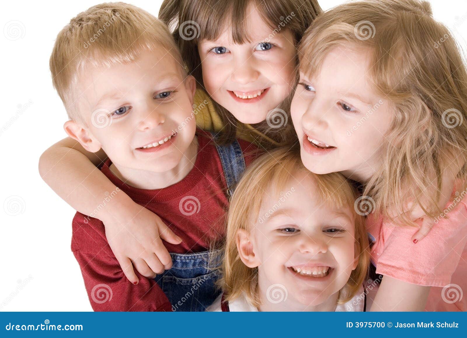 Four Children Hugging from Above Stock Photo - Image of four, group ...