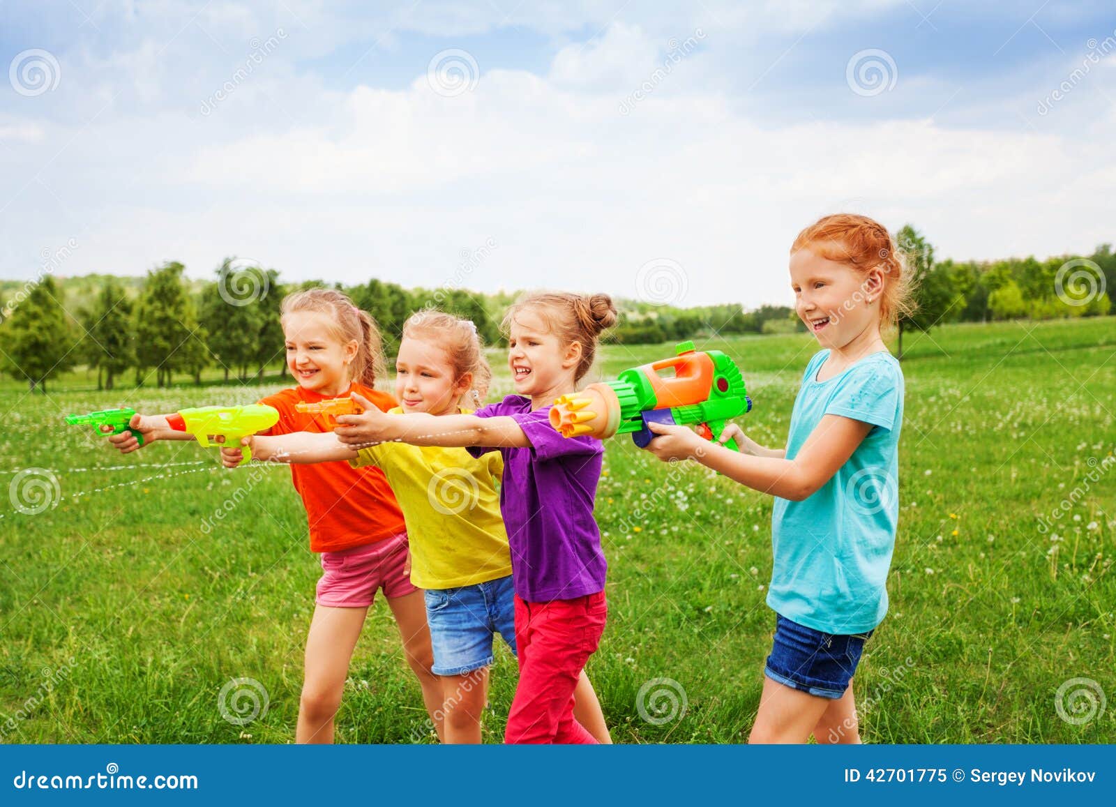 Four Children Playing with Water Guns Stock Image - Image of colors ...