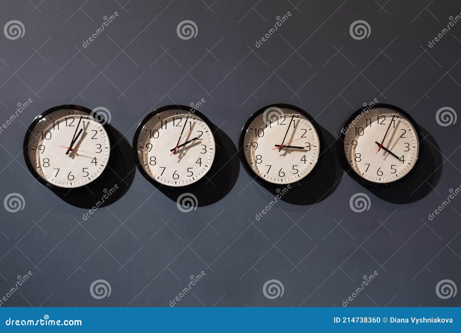 Four Clocks on the Black Wall Stock Photo - Image of timer, number ...