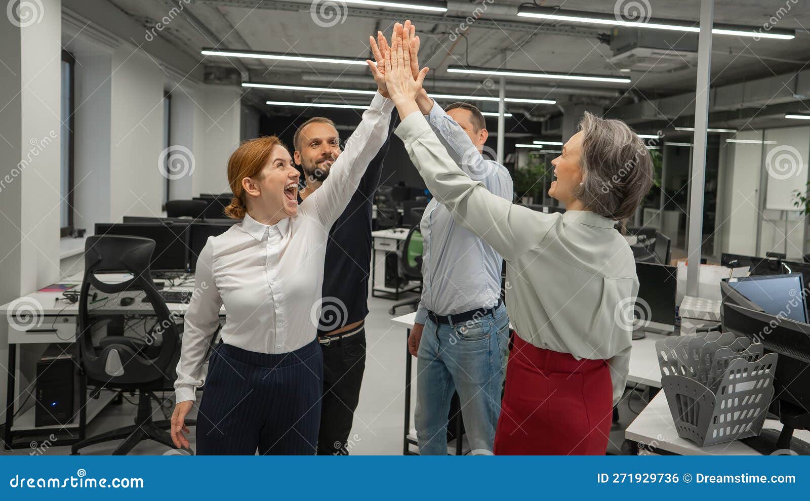 Four Co-workers Give a High Five in the Office. Stock Photo - Image of ...