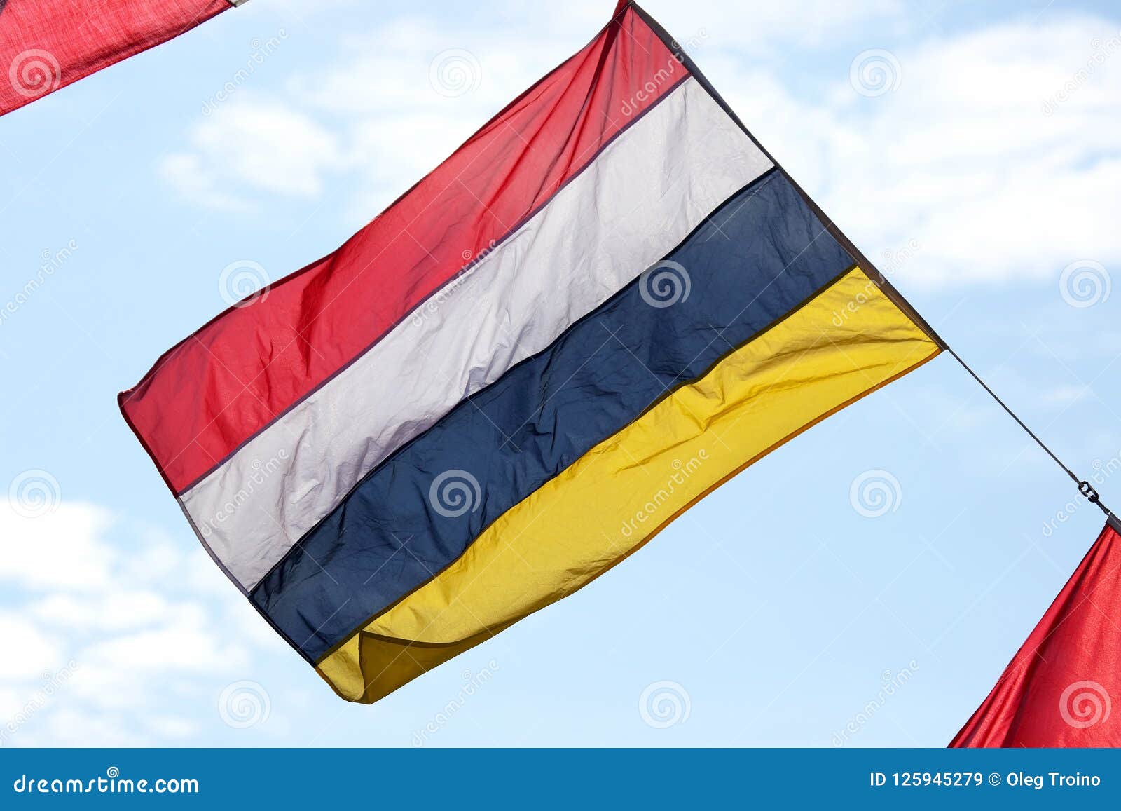 Four-color Flag on Sky Background Stock Image - Image of membership ...