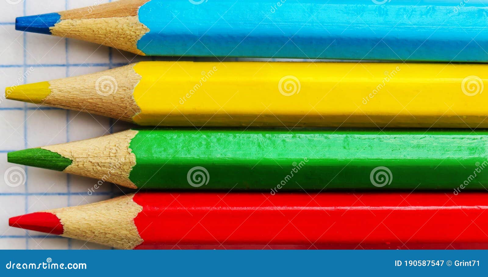 Four Colored Pencils on a Notebook Sheet in a Cage. To Close Stock ...
