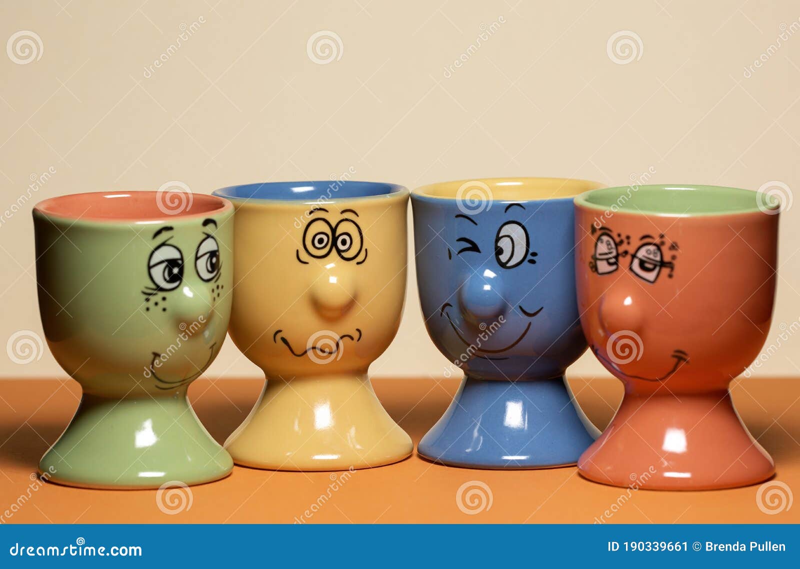 Four Comedy Egg Cups for Children or Easter. Stock Image - Image of ...
