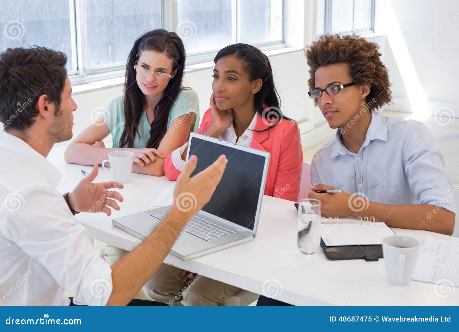 Four Coworkers Having a Discussion Stock Image - Image of colleagues ...