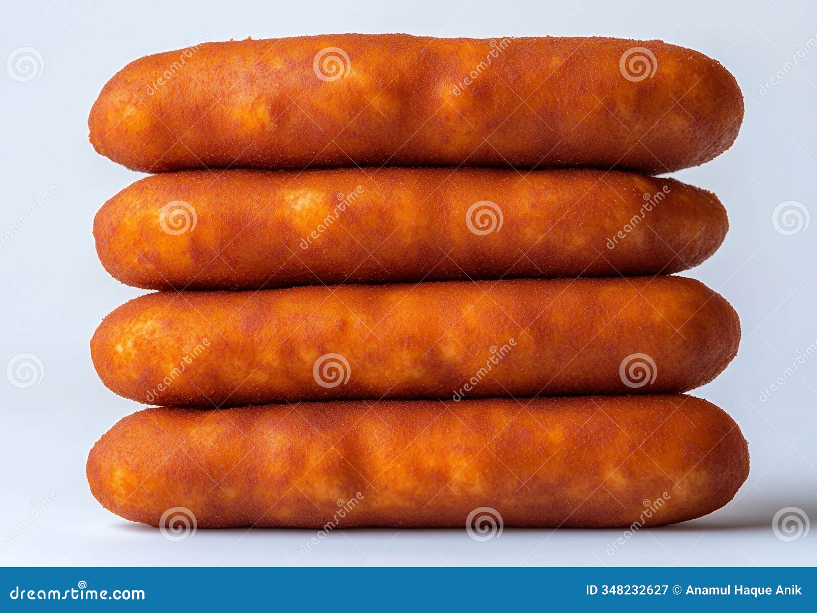 Four Crispy Fried Snacks Stacked on a White Background Stock ...